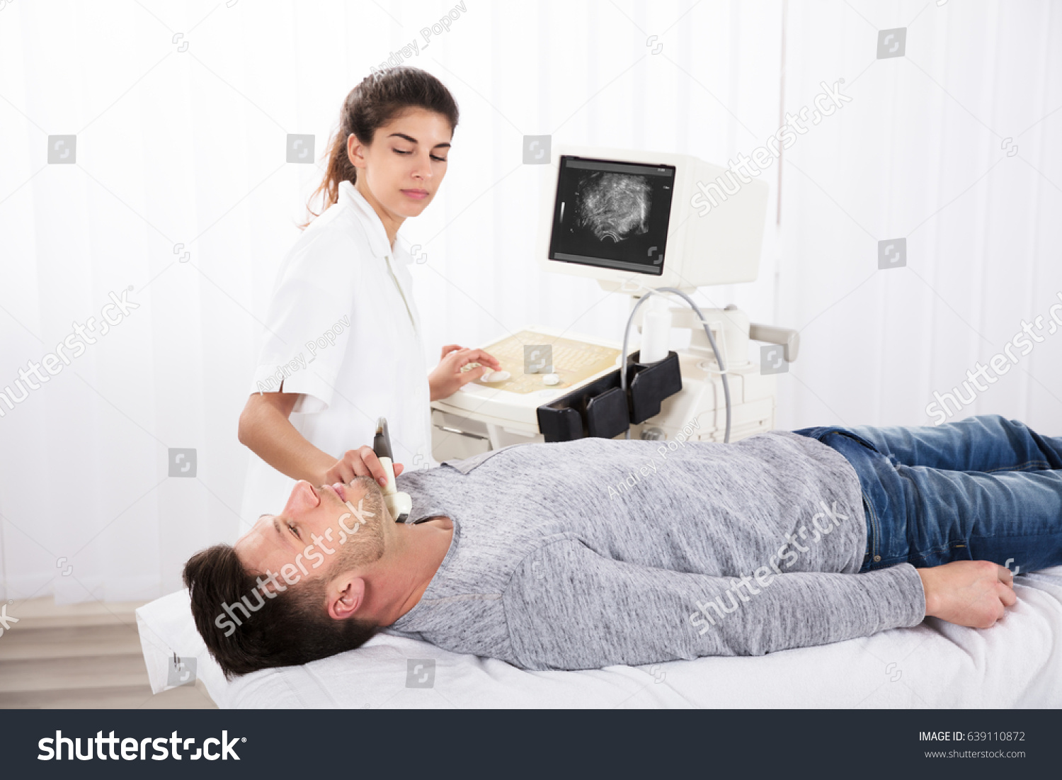 stock-photo-man-undergoing-the-medical-ultrasound-examination-in-clinic ...